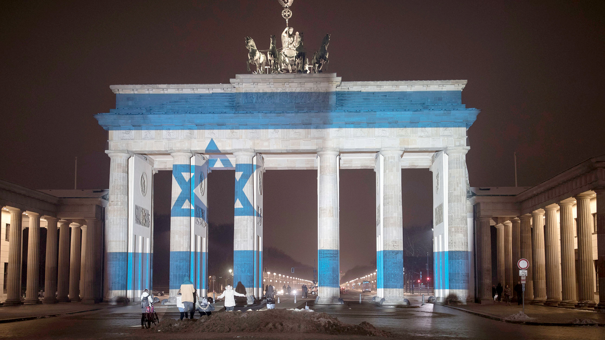 Brandenburg Gate lit up with Israeli flag after terrorist attack - The ...