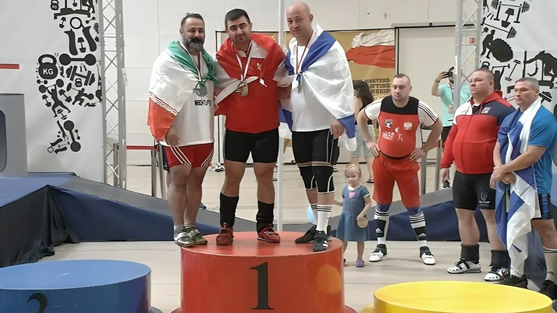 Iranian weightlifter banned for life after shaking hands with Israeli ...